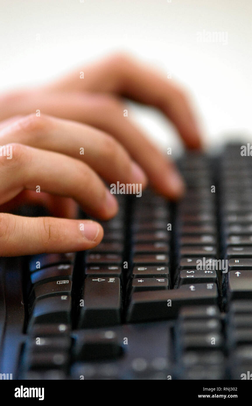 Secretary typing on a computer keyboard, Lyon, France Stock Photo - Alamy