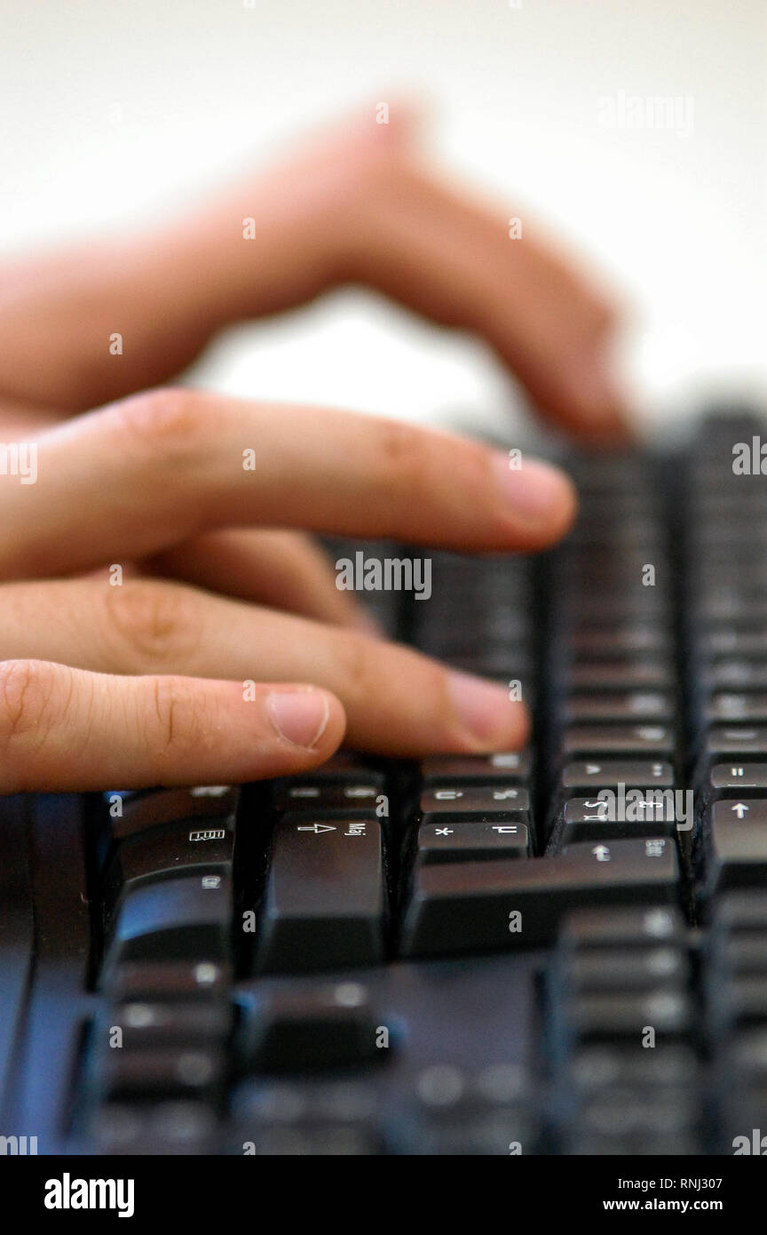 Secretary typing on a computer keyboard, Lyon, France Stock Photo - Alamy