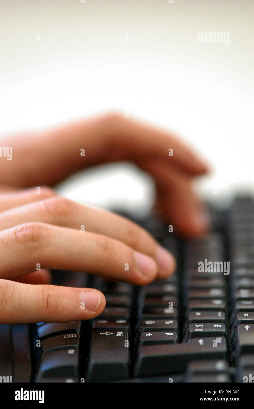 Secretary typing on a computer keyboard, Lyon, France Stock Photo - Alamy