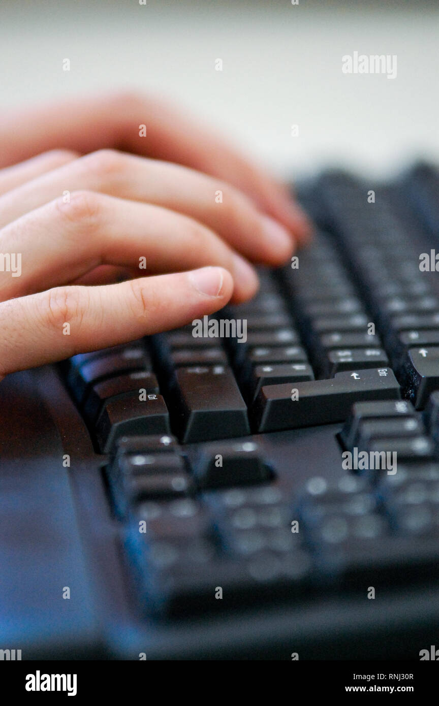Secretary typing on a computer keyboard, Lyon, France Stock Photo - Alamy