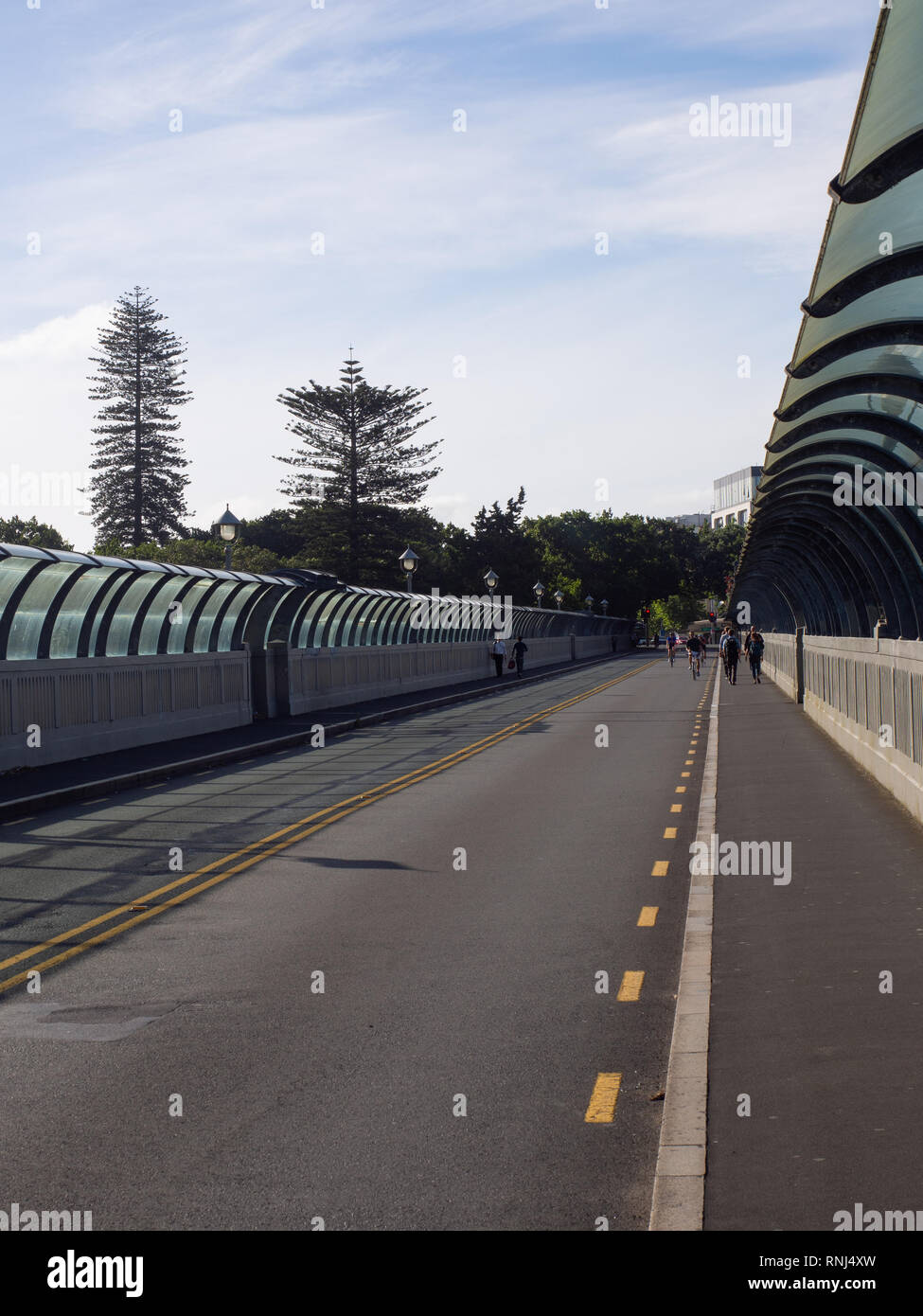 View along the roadway and footpath of Grafton Bridge in Auckland, New ...