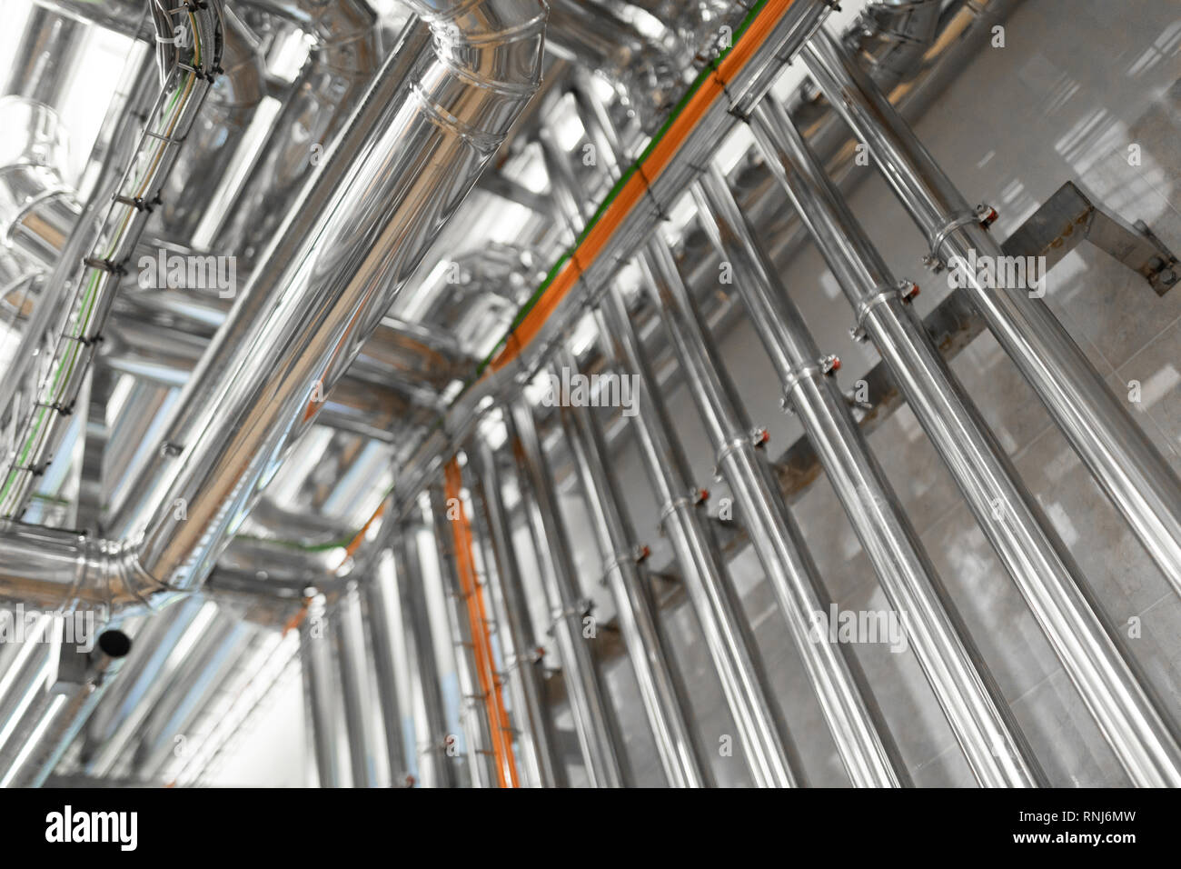 System of aluminum pipes at the food industry plant Stock Photo - Alamy
