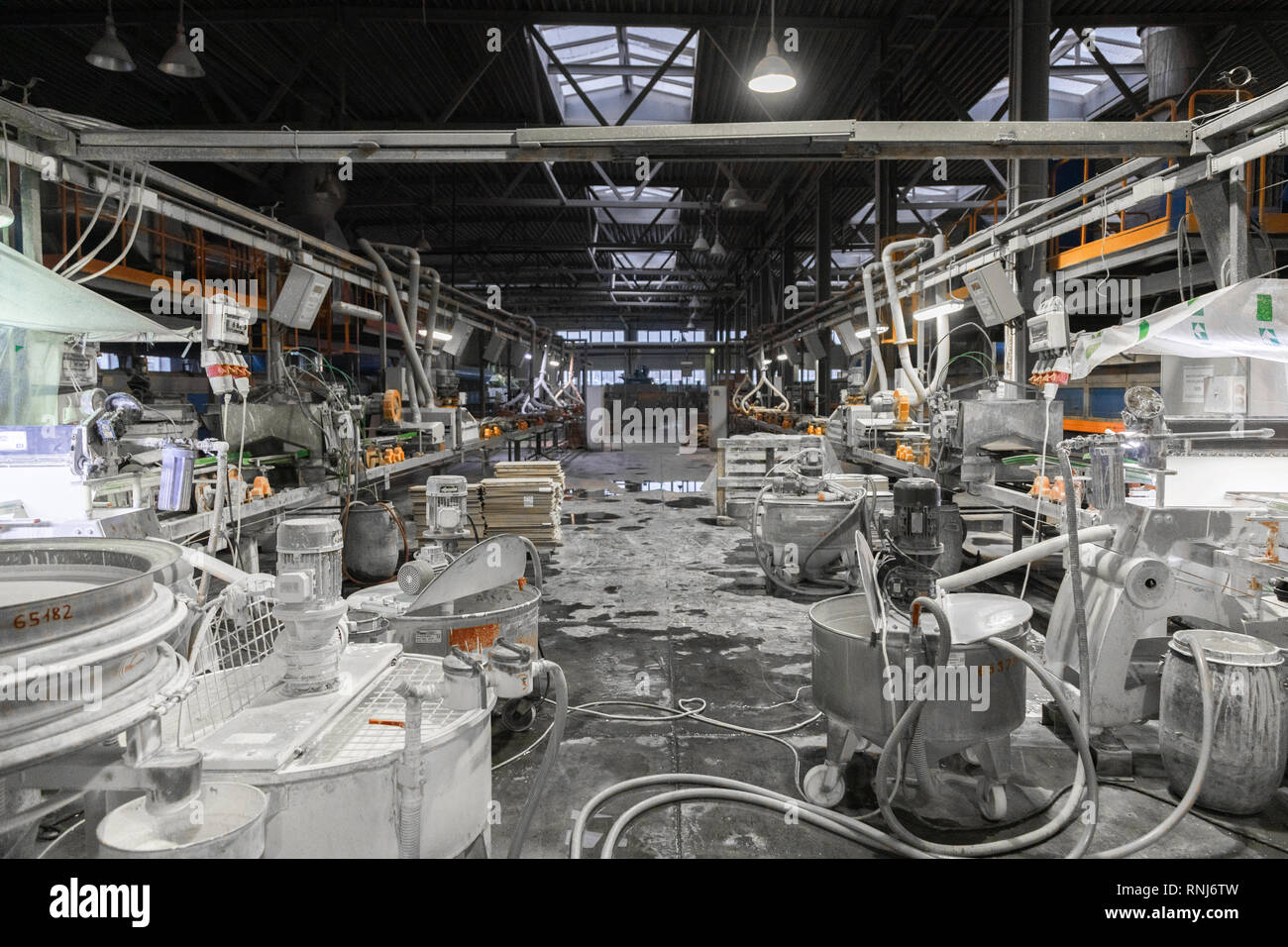 Manufacture of cement inside the building of the plant Stock Photo - Alamy