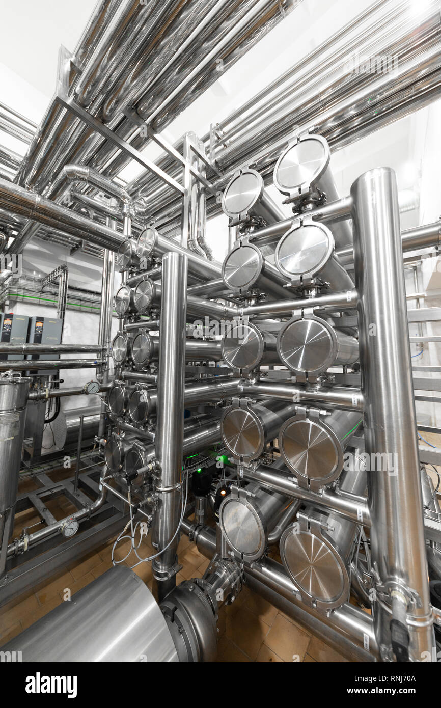 System of chrome-plated pipes at the food industry plant Stock Photo ...