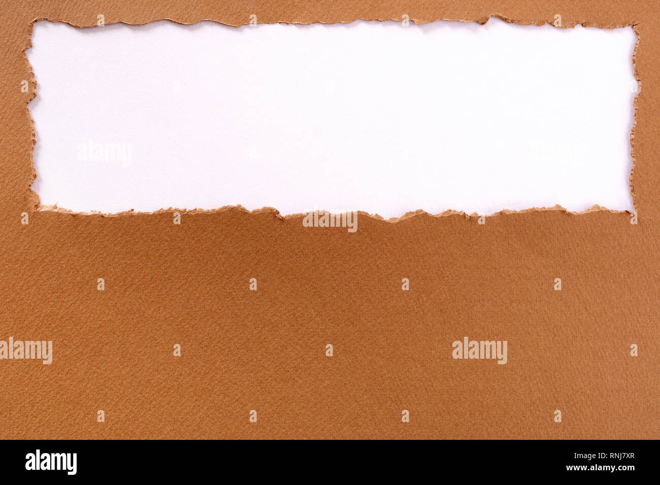 Torn brown paper background frame strip banner Stock Photo - Alamy
