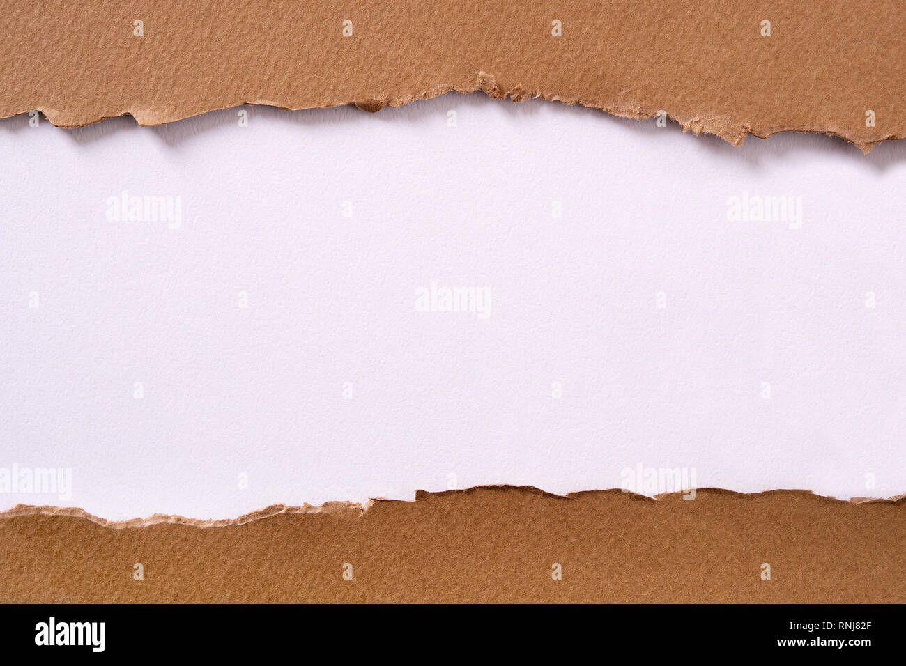 Torn brown paper center strip white background Stock Photo - Alamy