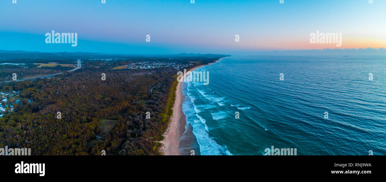 Aerial panorama of Corindi Beach ocean coastline at sunrise. Corindi ...