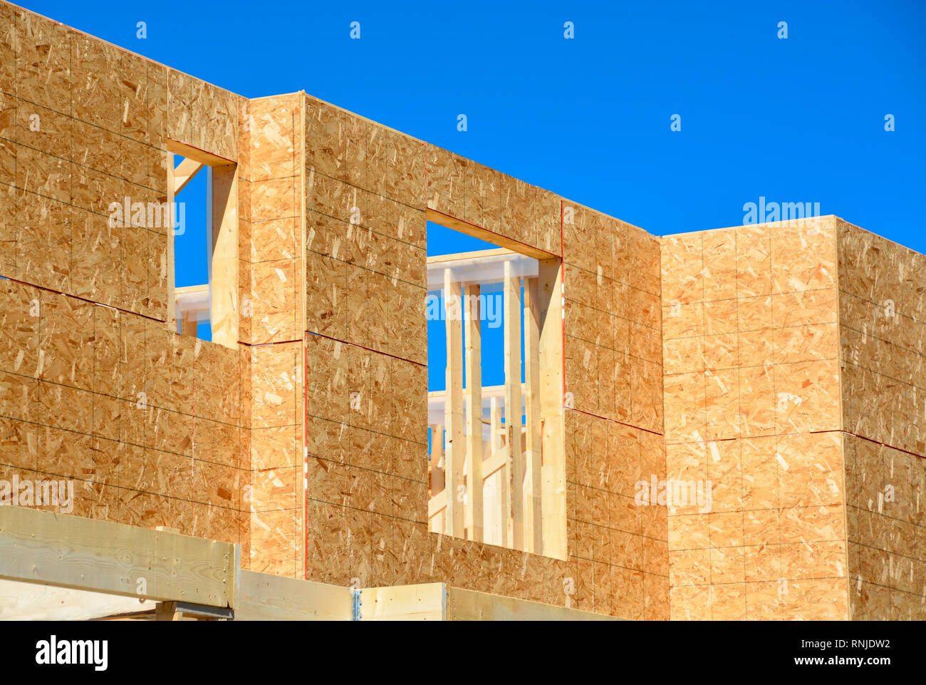 Window frame of new low rise building on blue sky background Stock ...