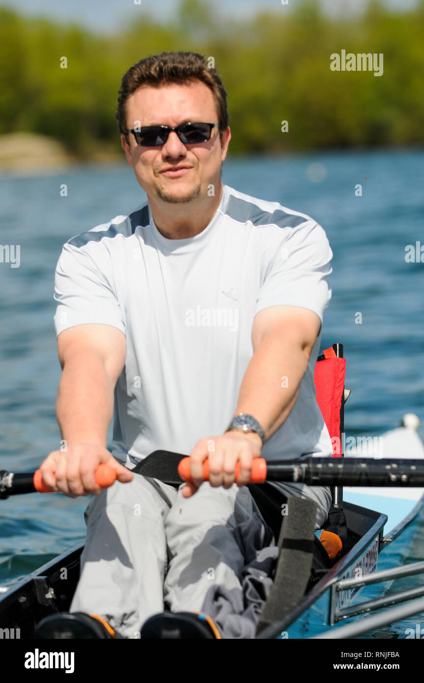 Paraplegic man enjoys rowing at Miribel-Jonage Park, France Stock Photo ...