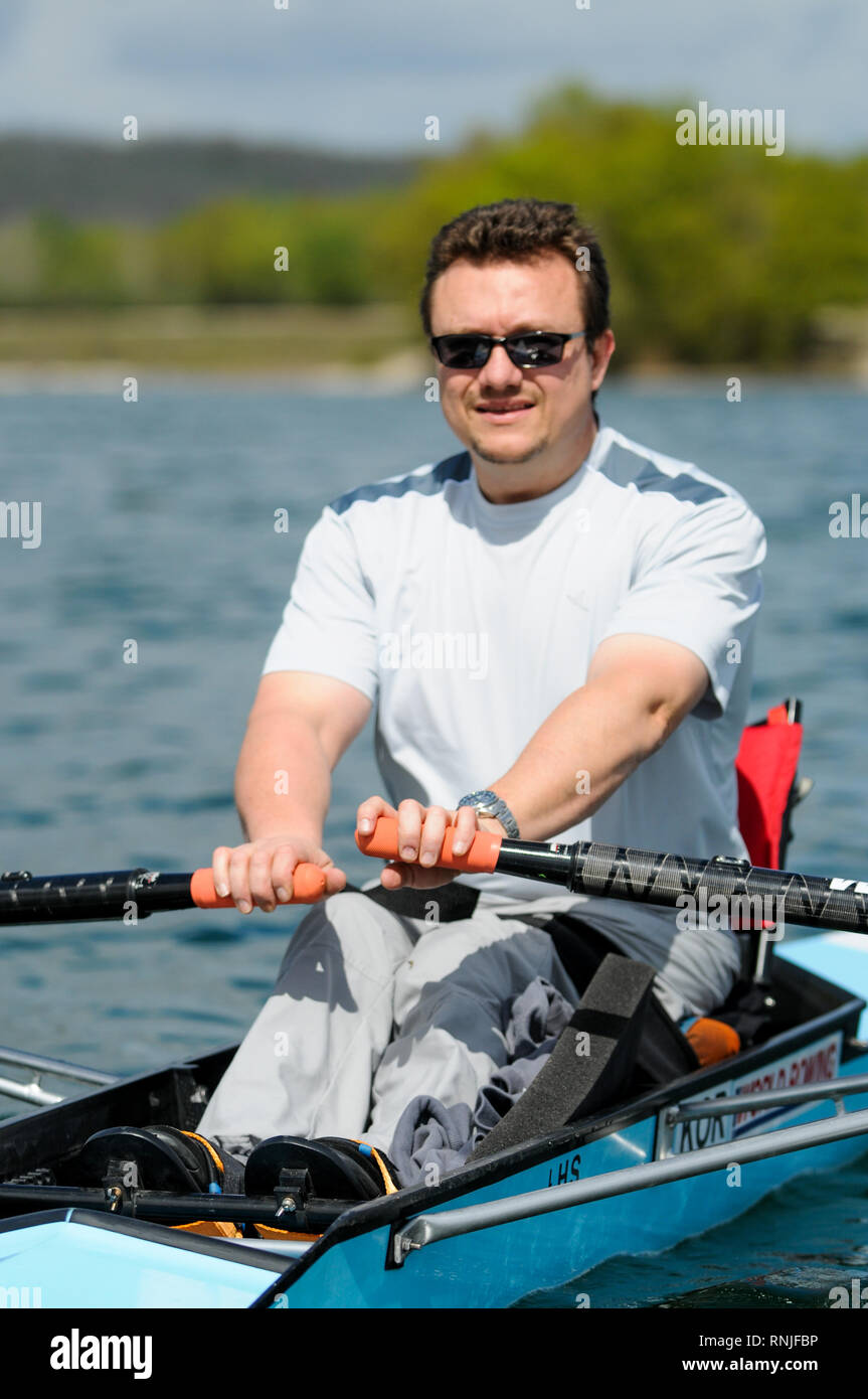 Paraplegic man enjoys rowing at Miribel-Jonage Park, France Stock Photo ...