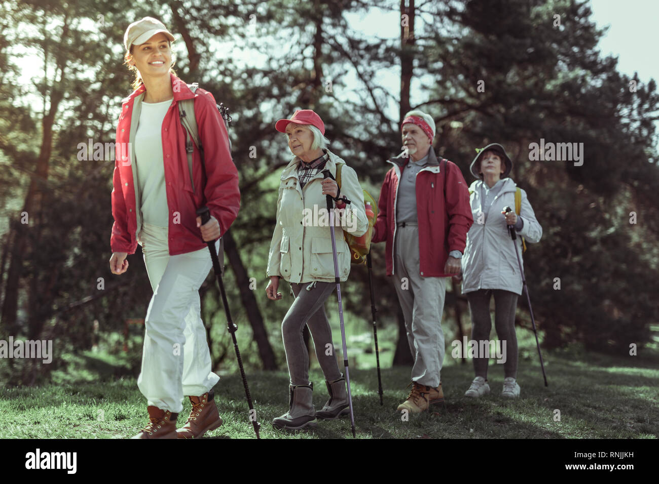 Group of tourists exploring local natural reserve Stock Photo - Alamy