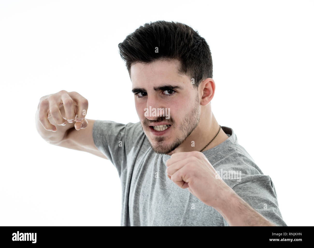Close up portrait of young violent man with angry face looking furious ...