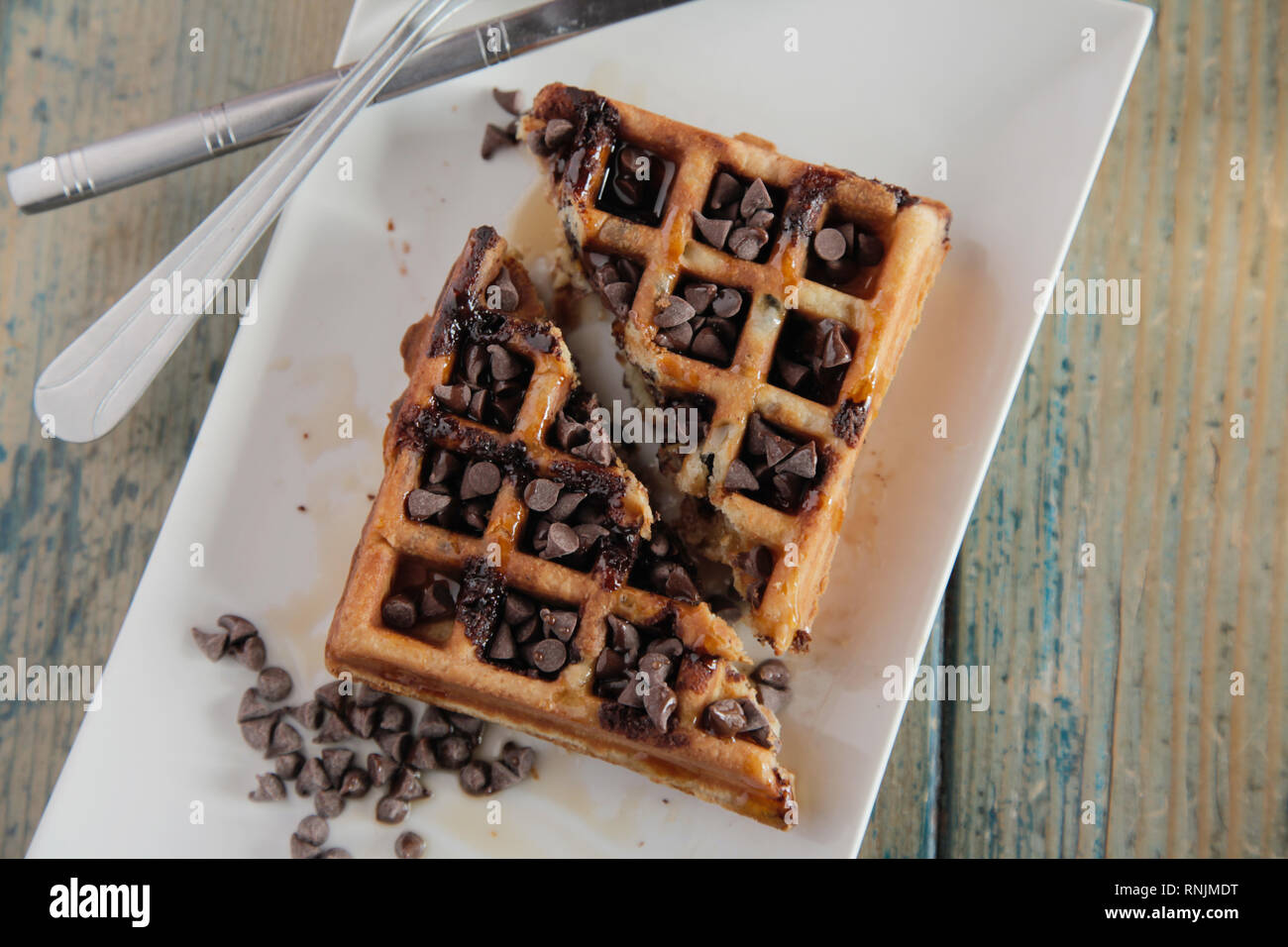 Top angle of chocolate chip waffle Stock Photo - Alamy