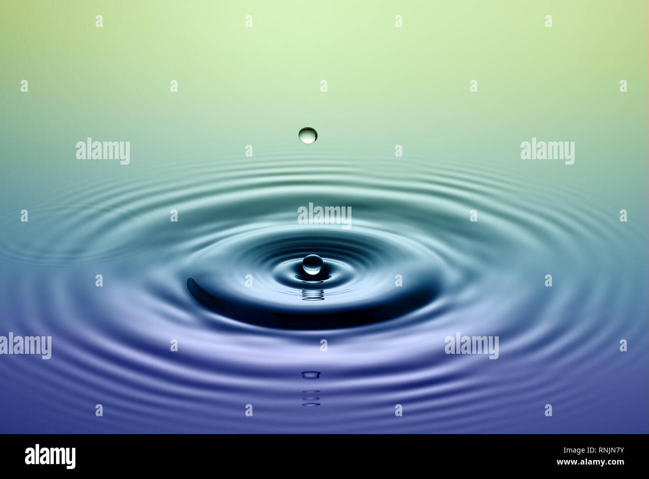 Splash closeup. Drop of rain fall on smooth water surface Stock Photo ...