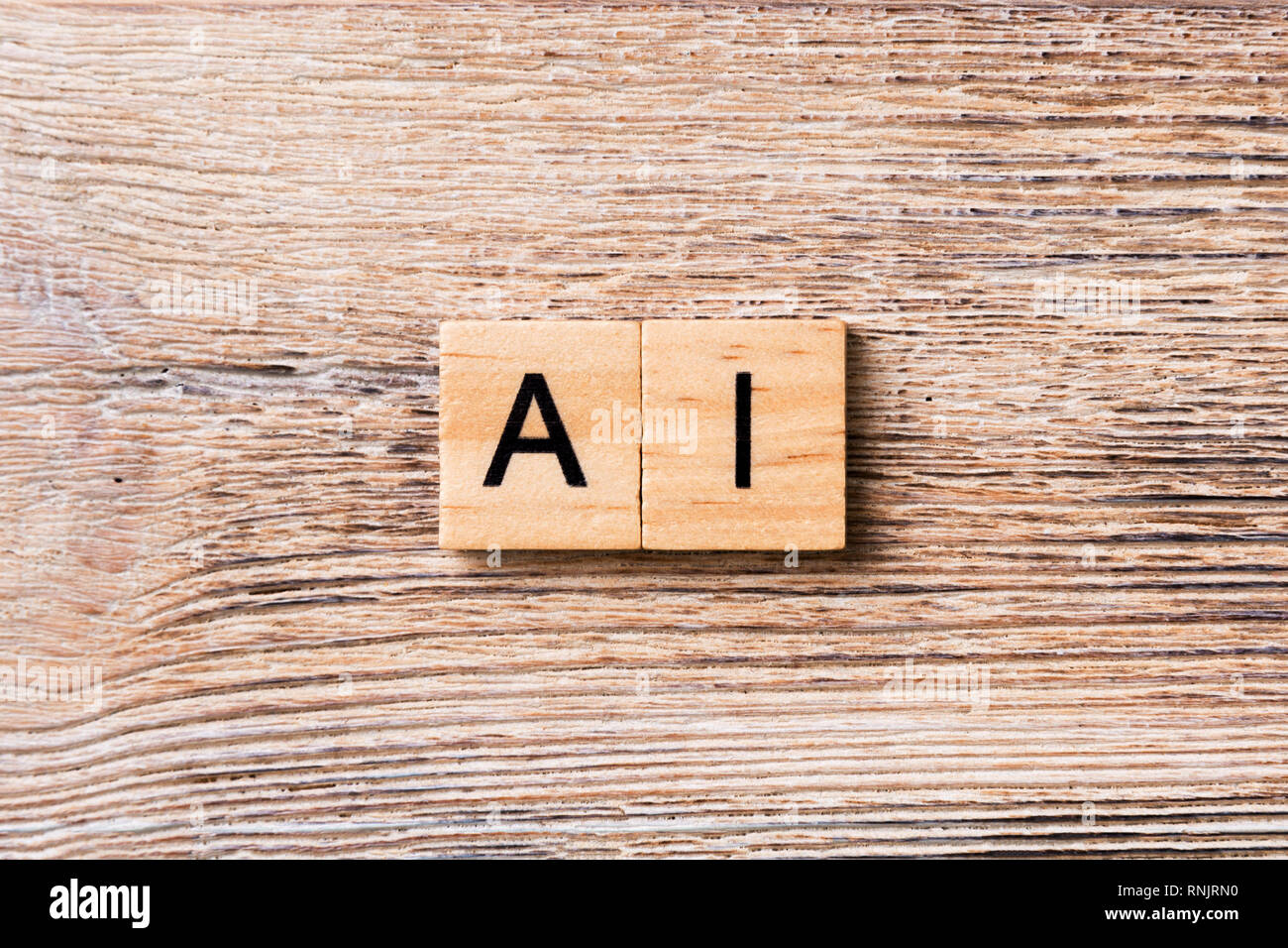 Artificial Intelligence word written on wood block. AI text on wooden ...