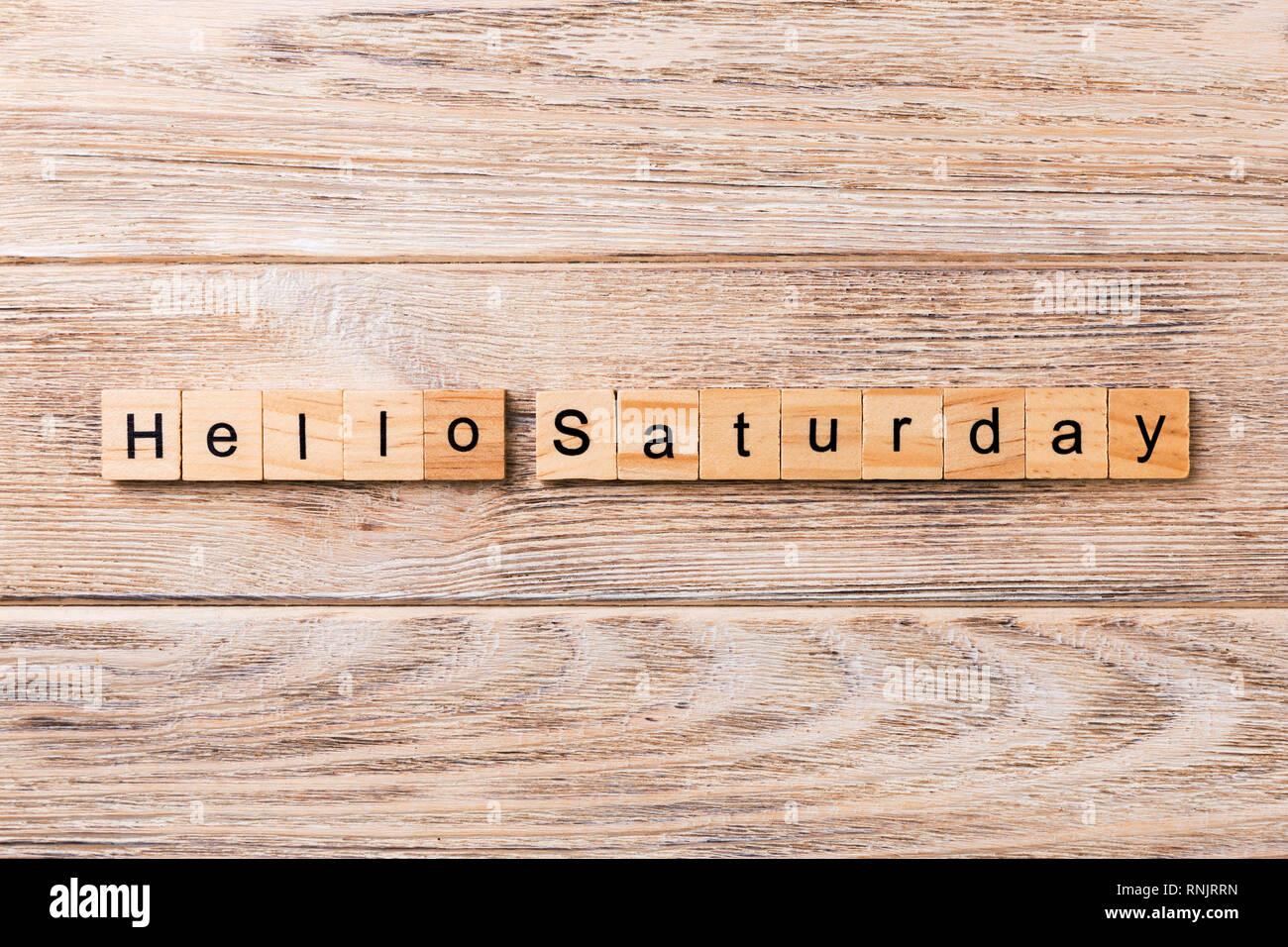 hello saturday word written on wood block. hello saturday text on ...