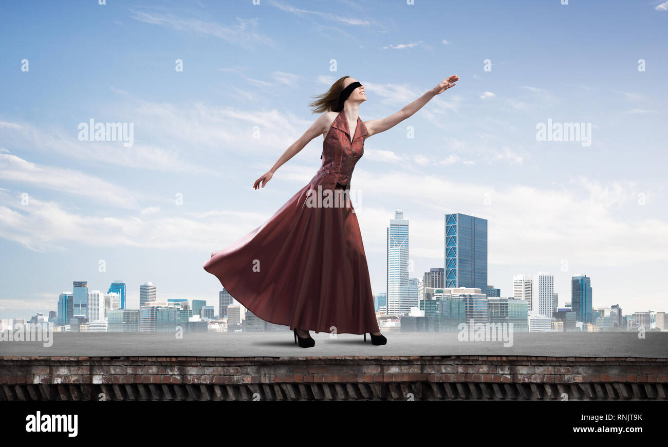 Blind woman in long red dress at top of building. Mixed media Stock ...