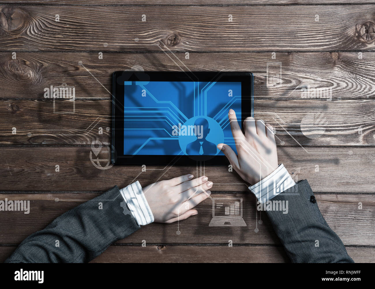 Business workplace with tablet device in female hands and media user ...