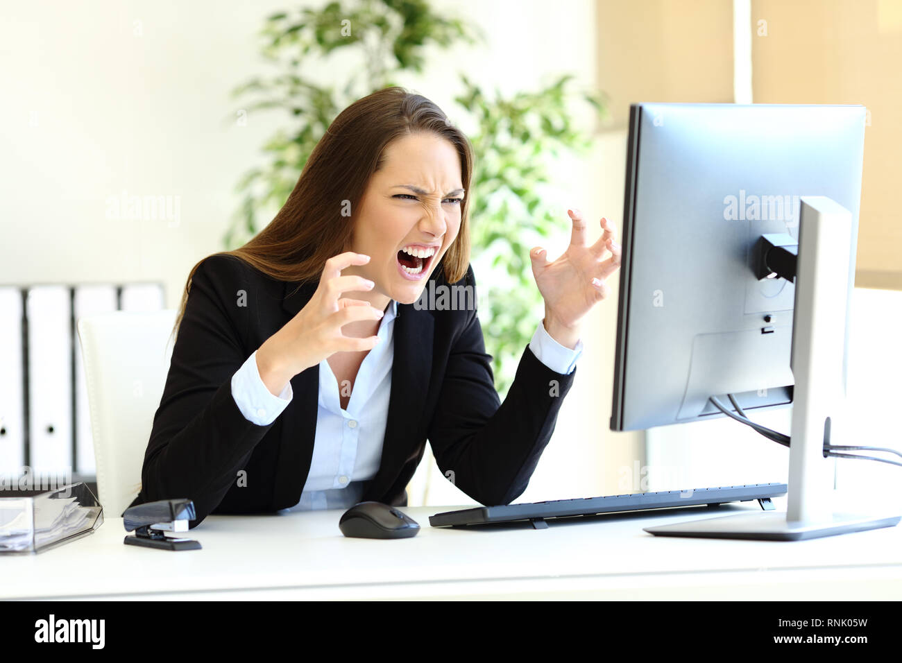 Angry office worker loosing control checking computer content Stock ...