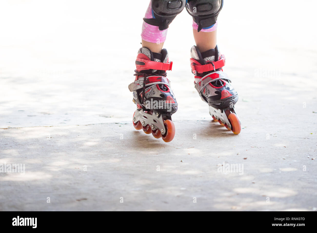 Human legs rollerblading wearing sportswear Stock Photo - Alamy