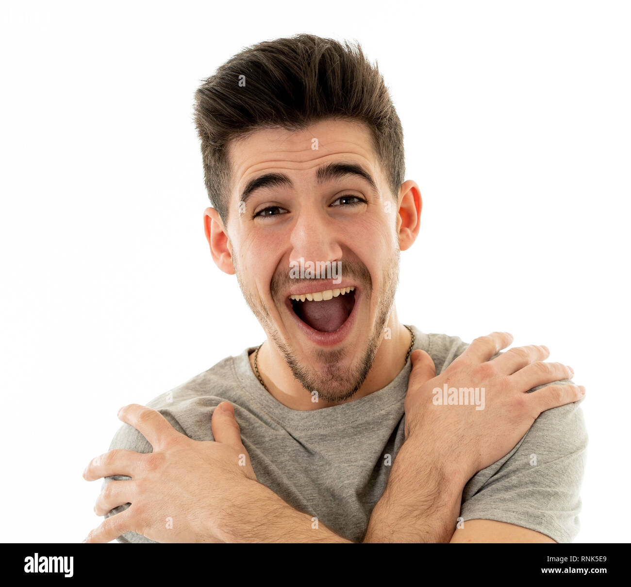 Portrait of young man celebrating achievement, a football goal, wining ...