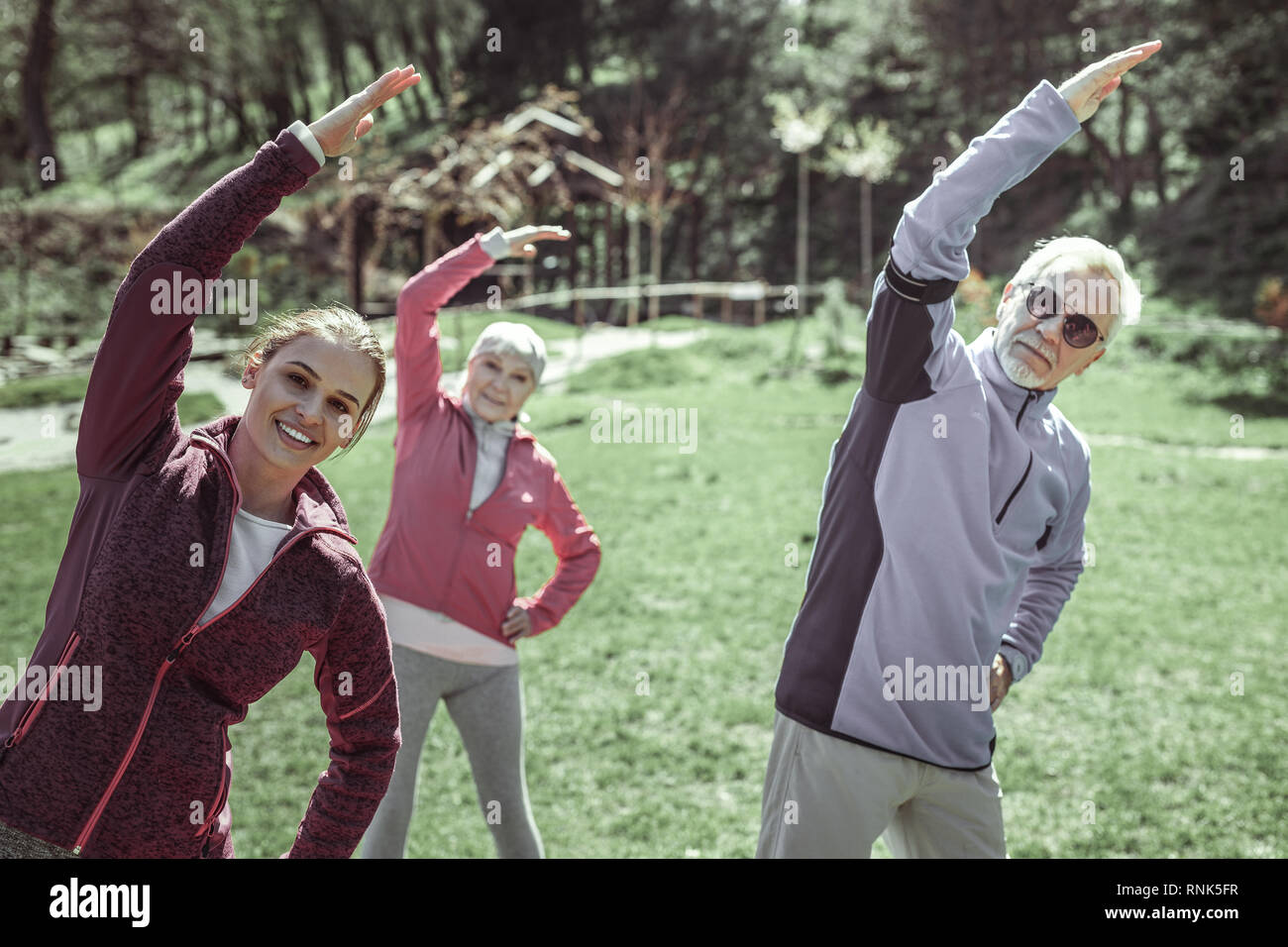 Warm up exercise smiling laughing hi-res stock photography and images ...