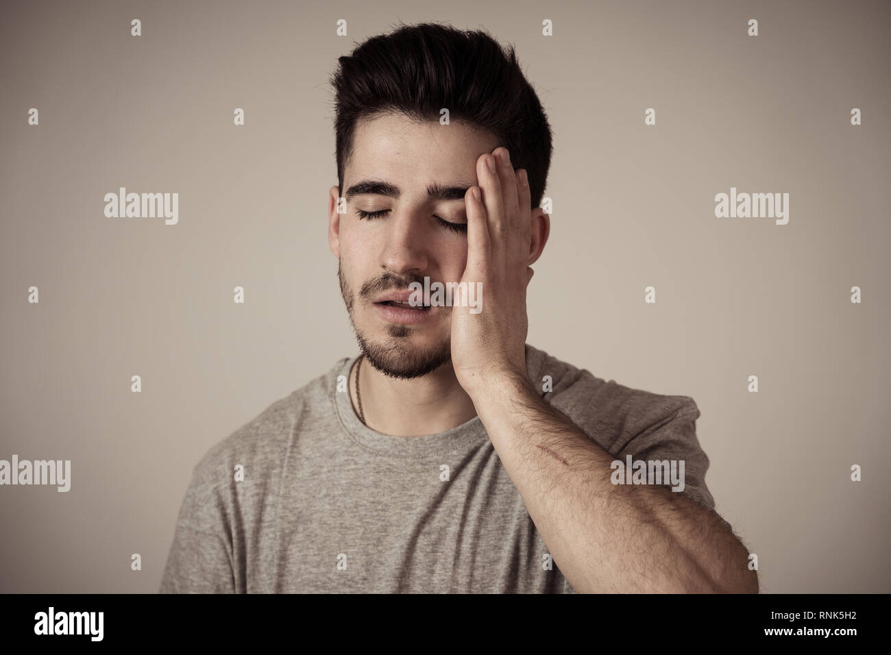 Close up portrait of handsome young man crying suffering from ...
