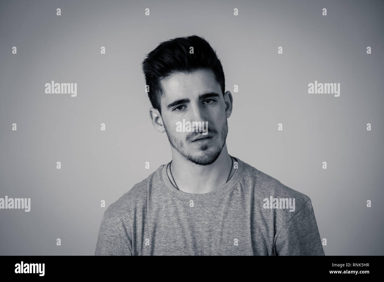 Close up portrait of handsome desperate young man suffering from ...