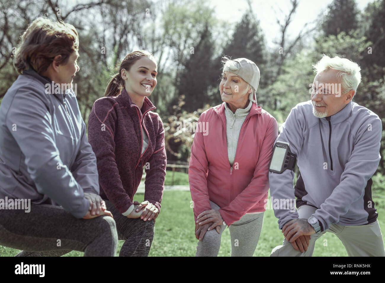 Beauteous cute coach laughing during hard exercise Stock Photo - Alamy