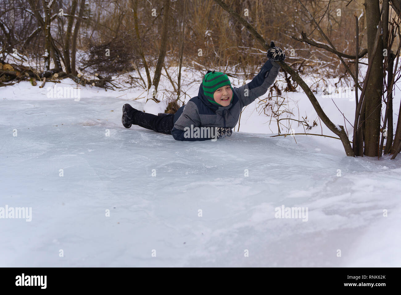 Boy on ice hi-res stock photography and images - Alamy