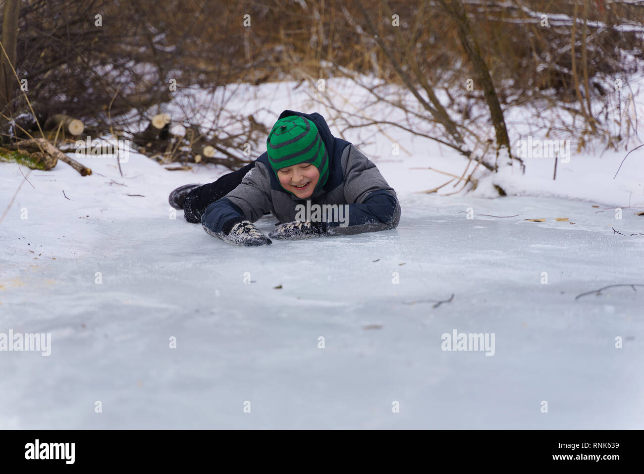 Child sliding ice hi-res stock photography and images - Alamy