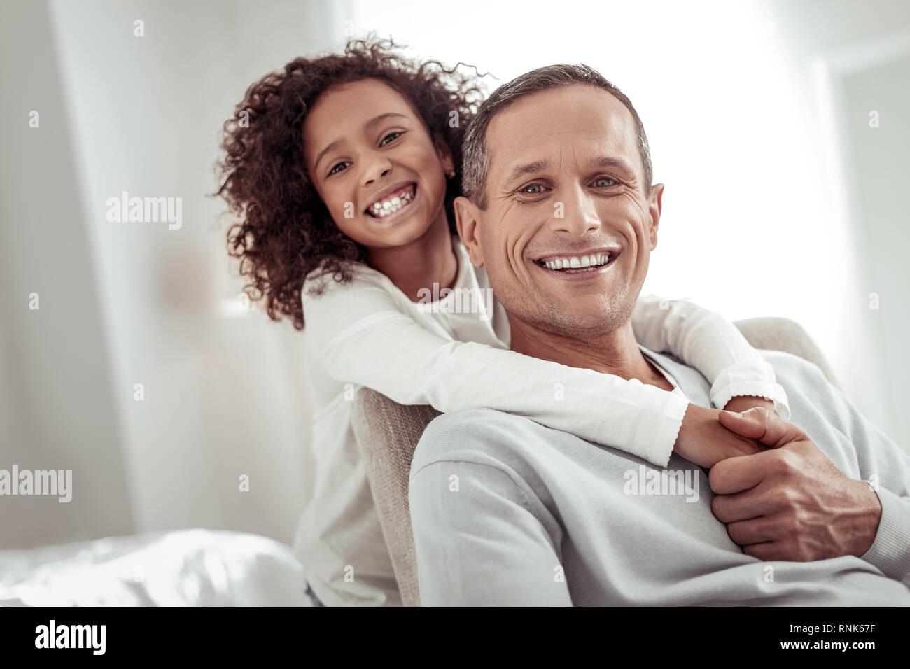 High-spirited joyful girl and father playing together Stock Photo - Alamy