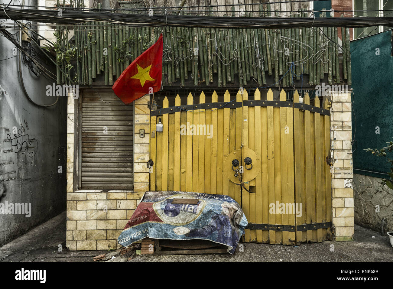 Saigon door flag red yellow star communist regime developing country hi ...