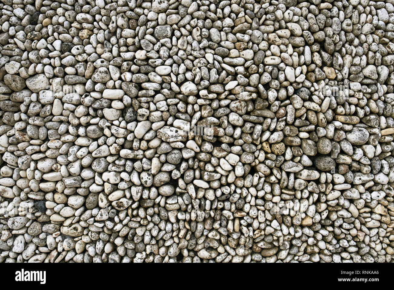 Image of many pebbles of different sizes and forms. Closeup. Horizontal ...