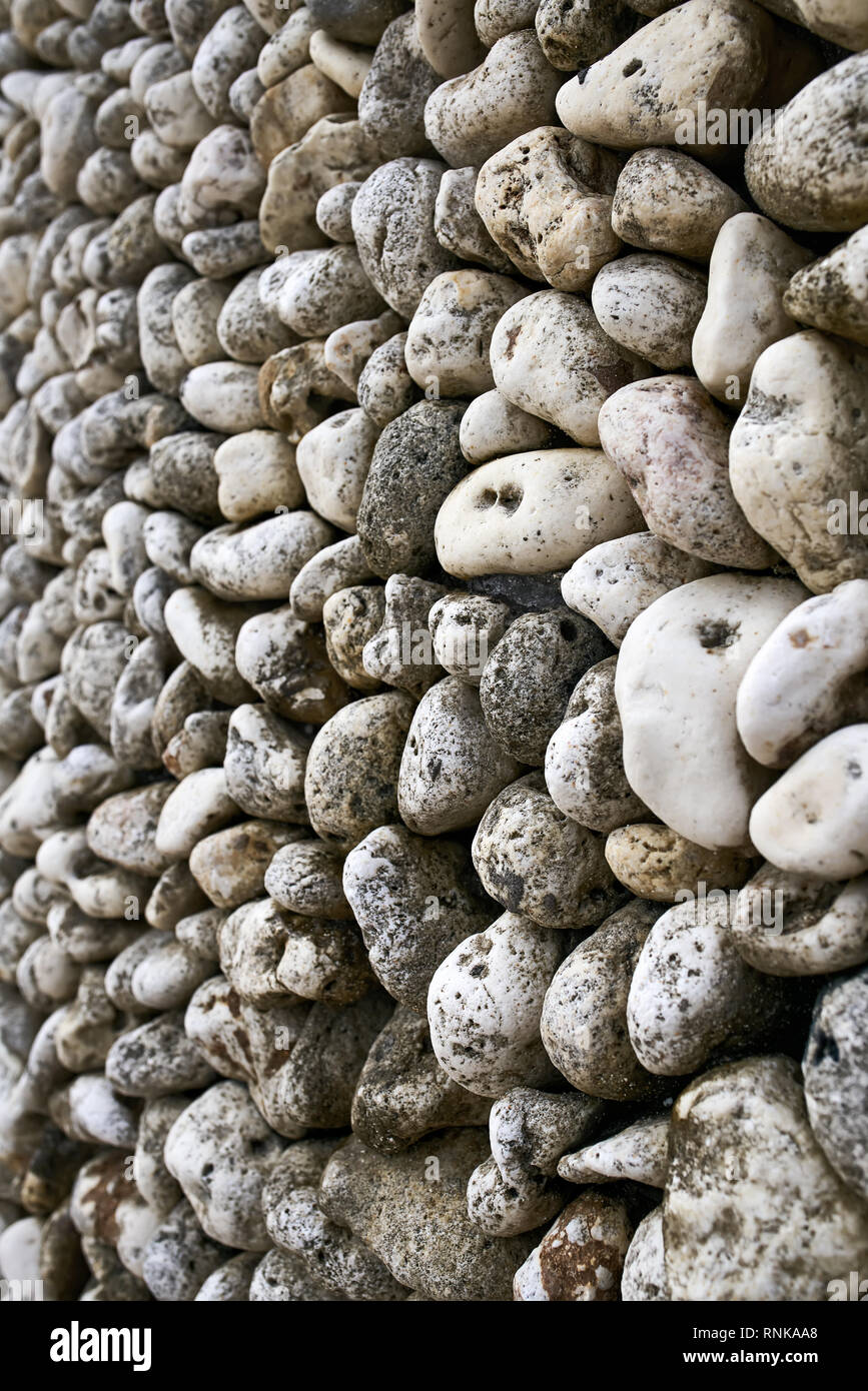 Closeup photo of many pebbles of different sizes and forms. Vertical ...