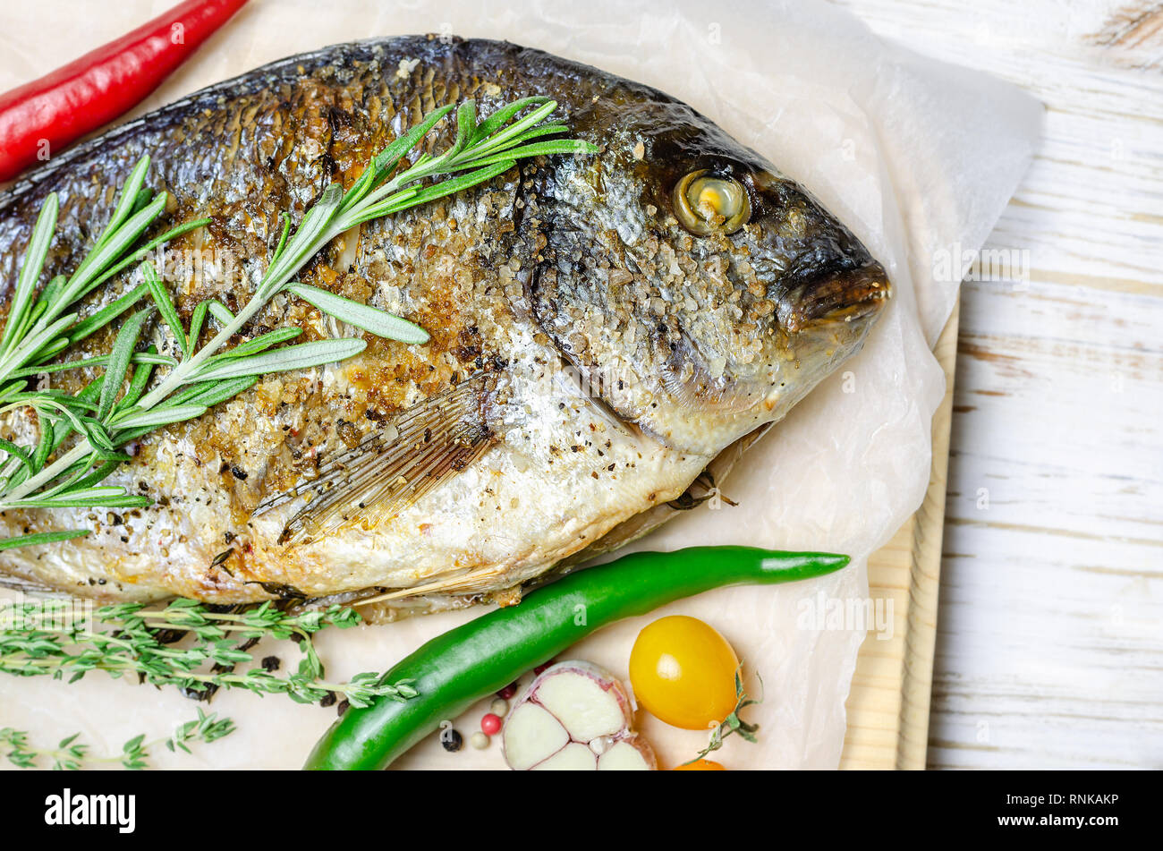Grilled Dorado with herbs and red pepper Stock Photo - Alamy