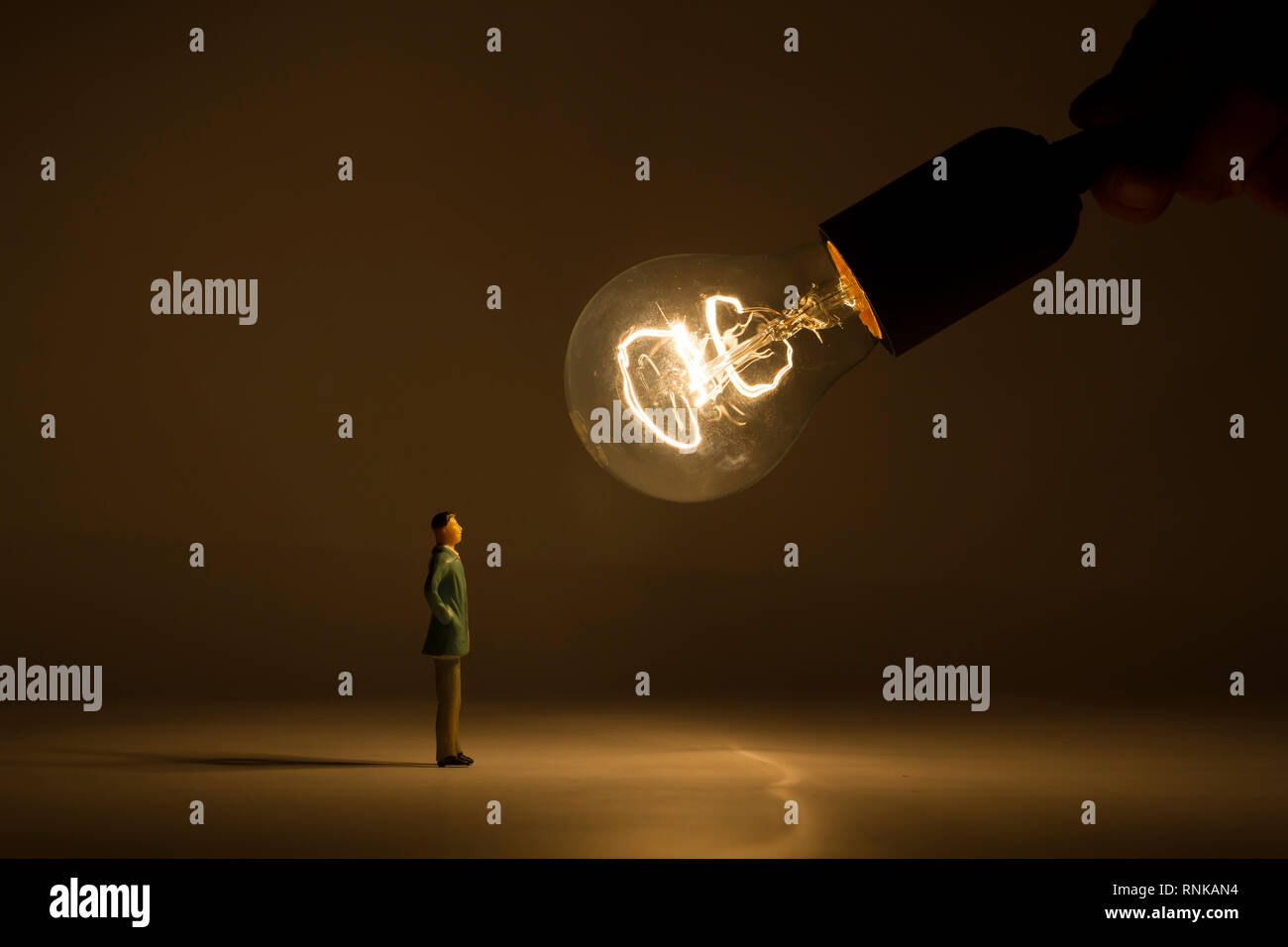 Glowing light bulb and villain, guide and guide Stock Photo - Alamy