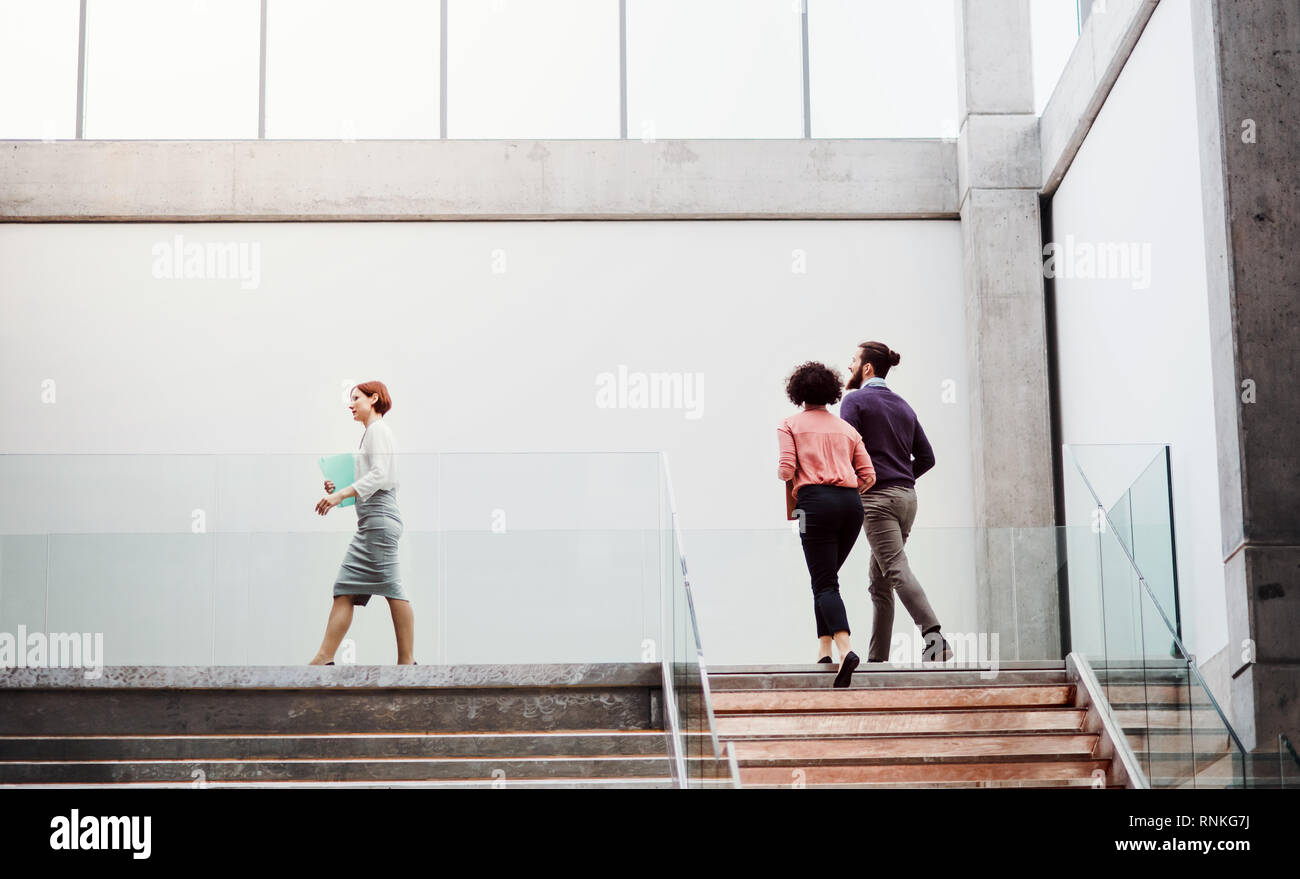 Man walking up office stairs hi-res stock photography and images - Alamy