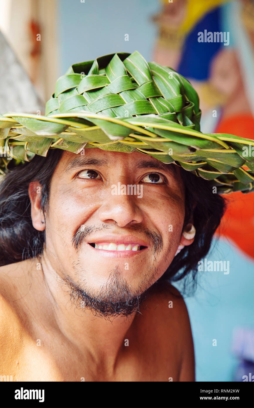 Portrait closeup of young native latino man with fresh handmade palm ...