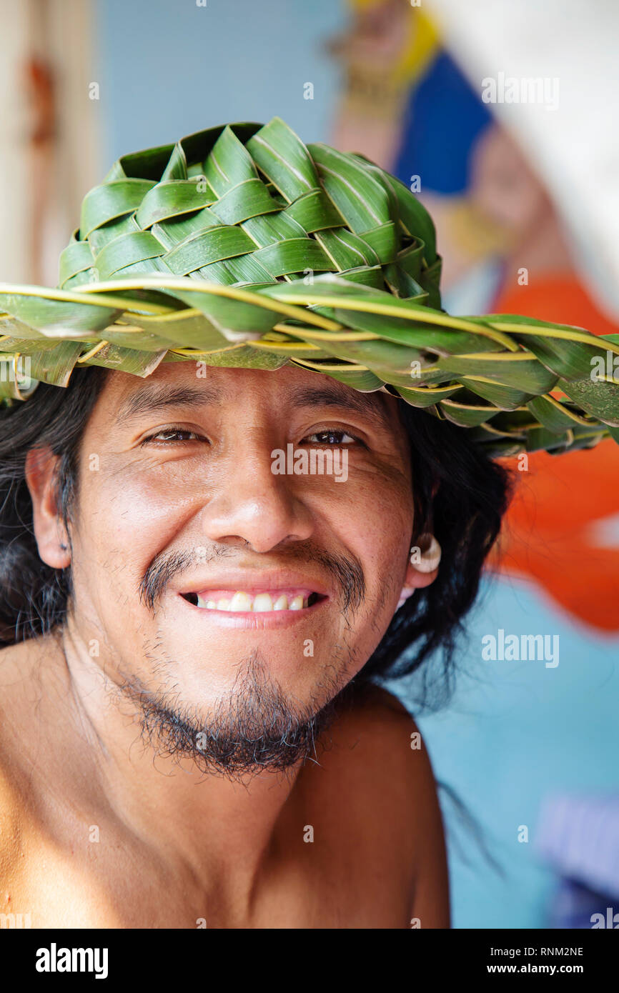 Portrait closeup of young native latino man with fresh handmade palm ...