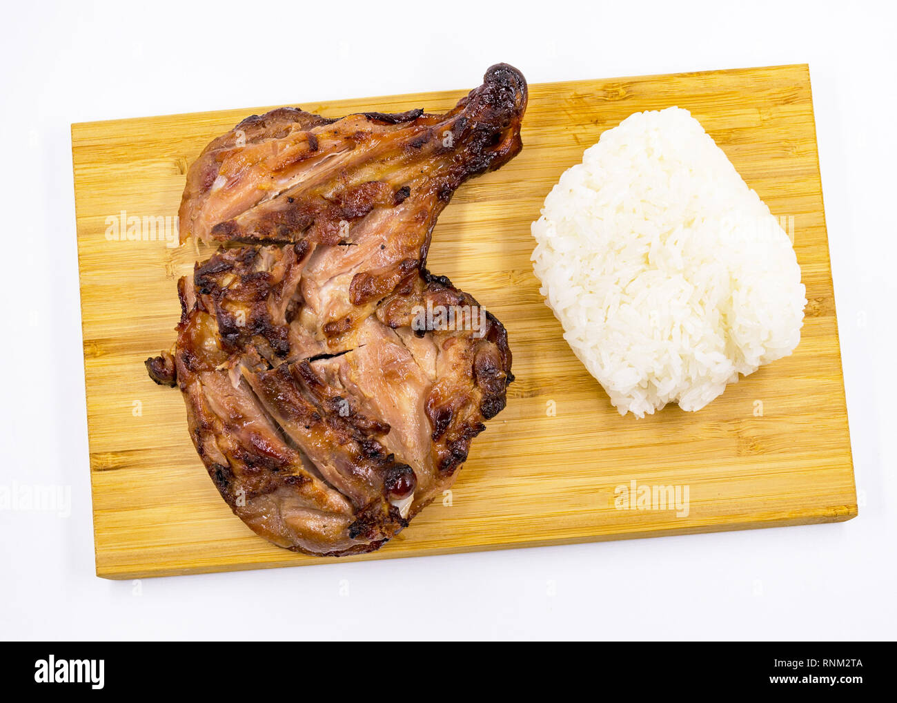 Grilled chicken drumstick and Sticky rice on wooden background Stock ...