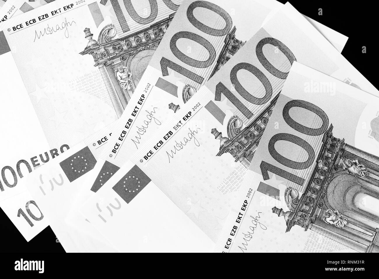 One Hundred euro banknotes as a background close up. Black and white ...