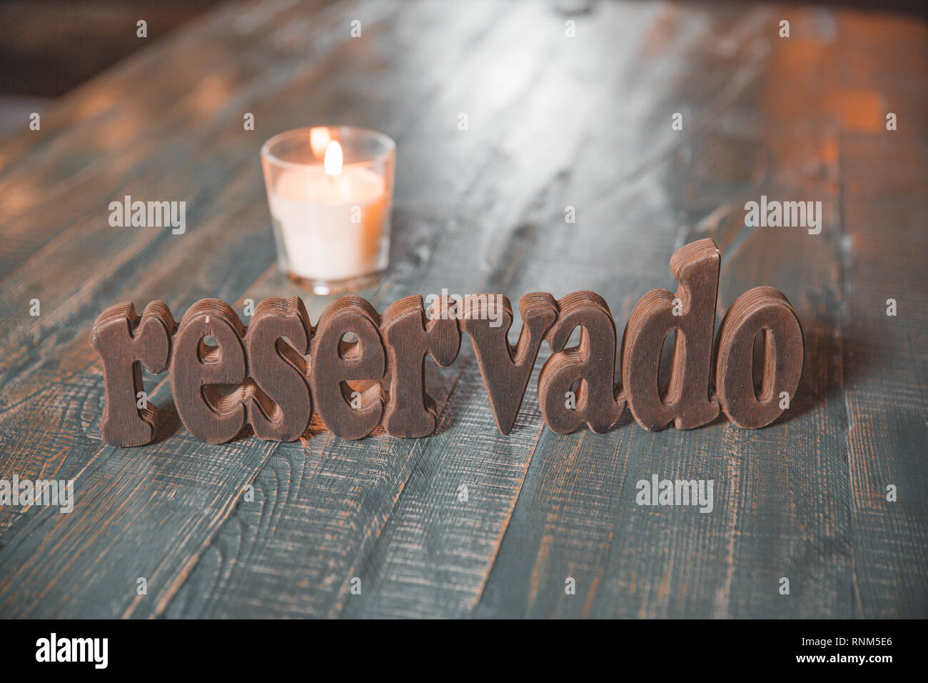 Restaurant reserved table sign with places setting and candle ...