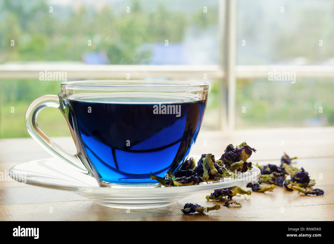Cup of blue tea for healthy drinking, detox drinking on wooden table ...