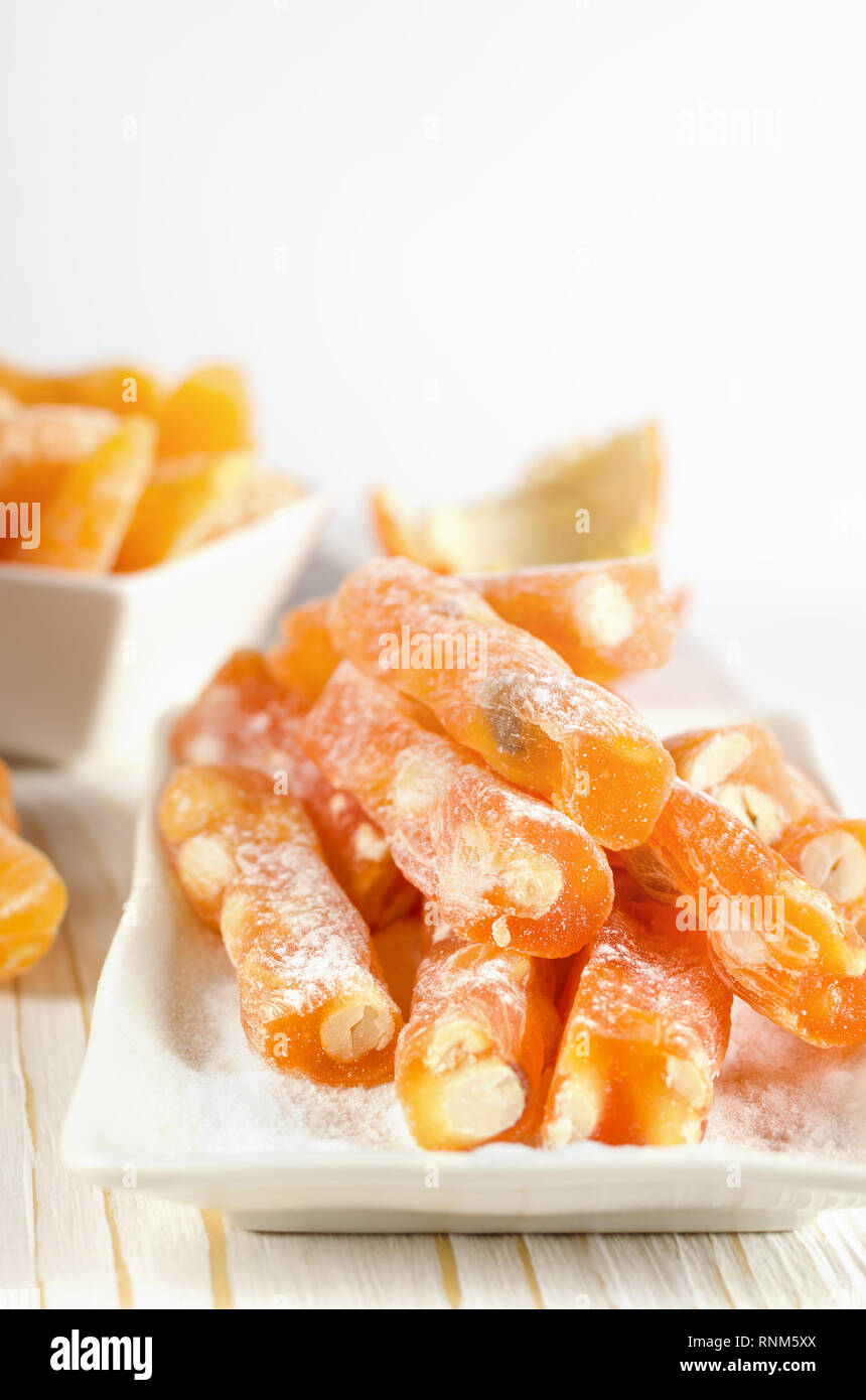 Orange Turkish delight with peanut and orange juice on white background ...