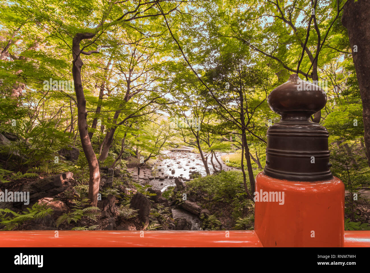 Japanese vermilion Tsuten bridge and its post surmounted by a giboshi ...