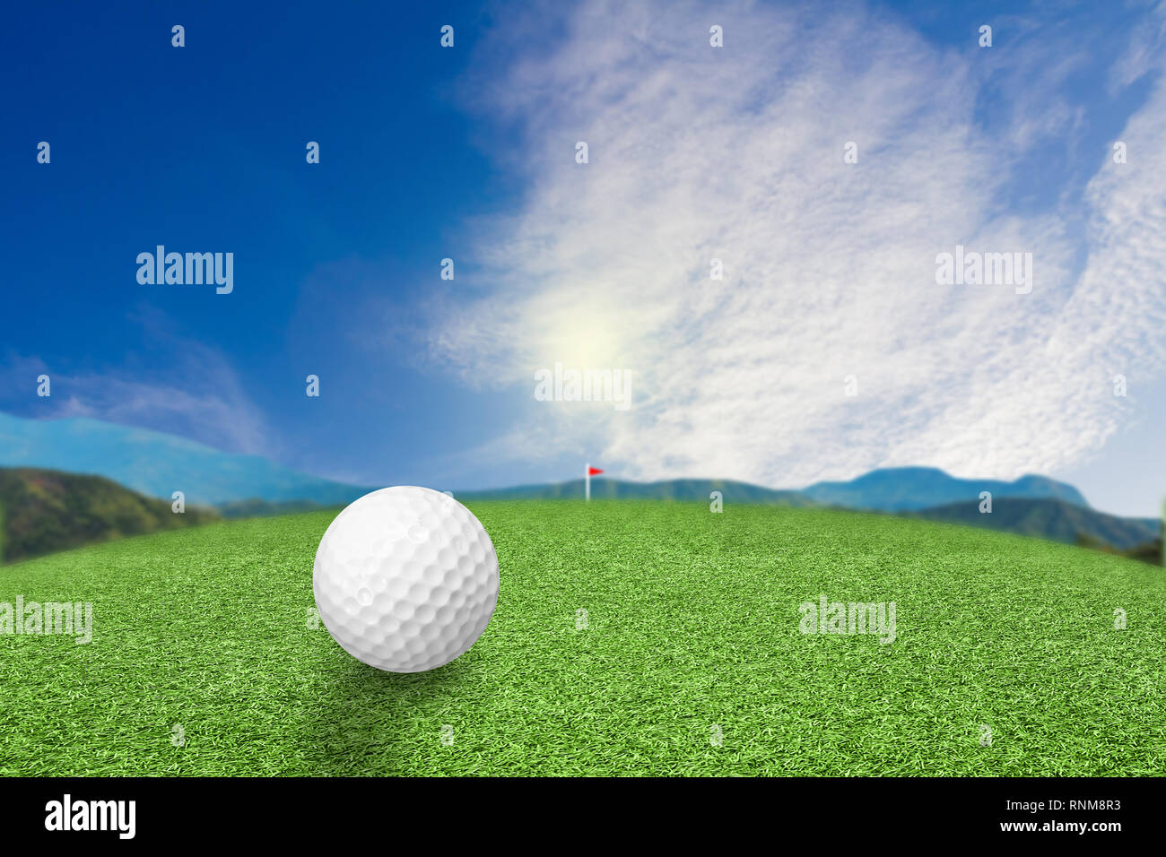Golf ball on grass nature background Stock Photo - Alamy