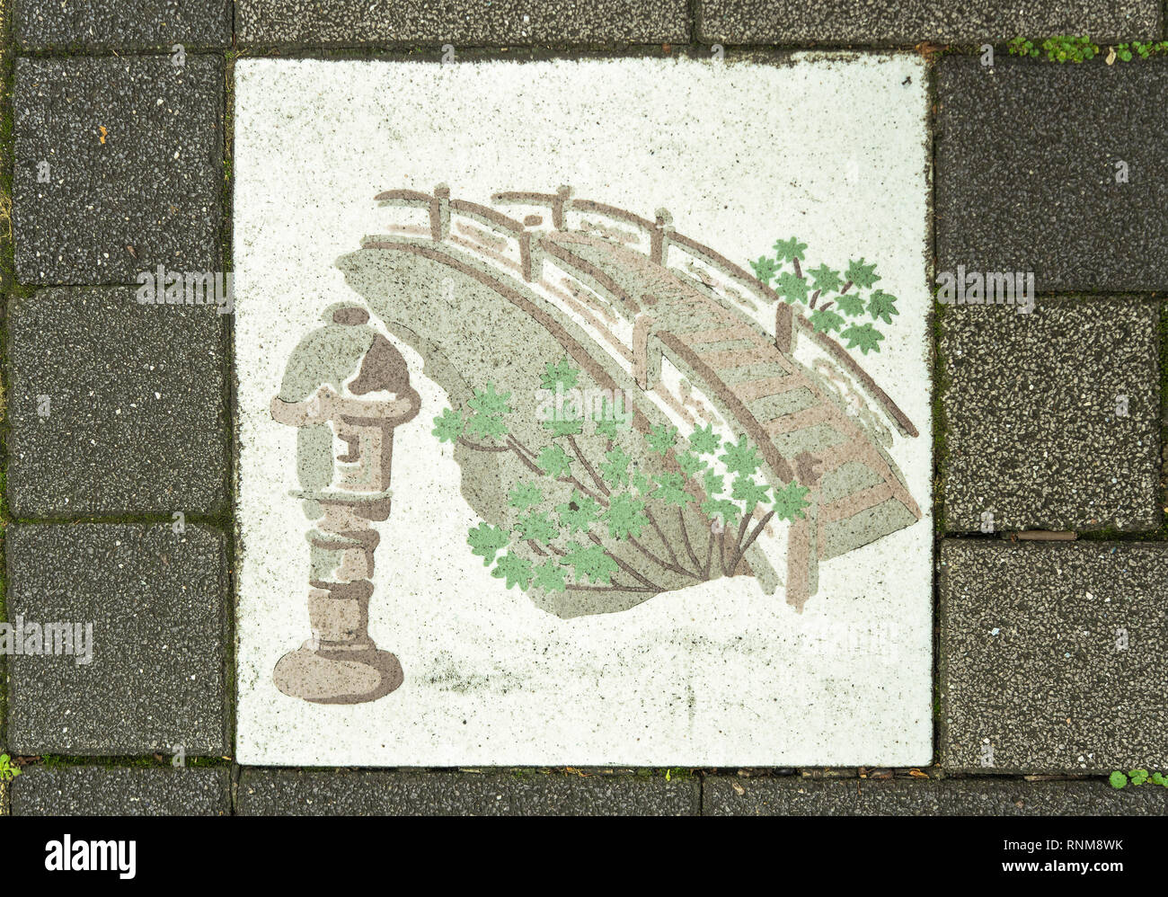 Japanese ceramic tile decorated with stone lantern, wooden bridge and ...