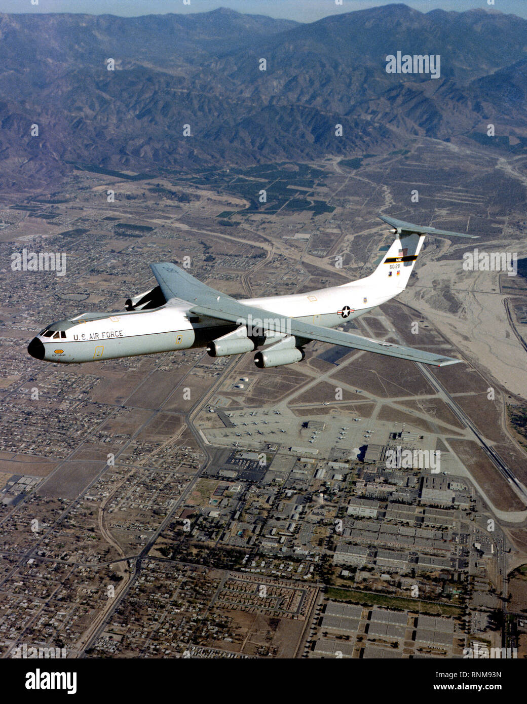 1980 - An air-to-air left side view of a C-141 Starlifter aircraft over ...