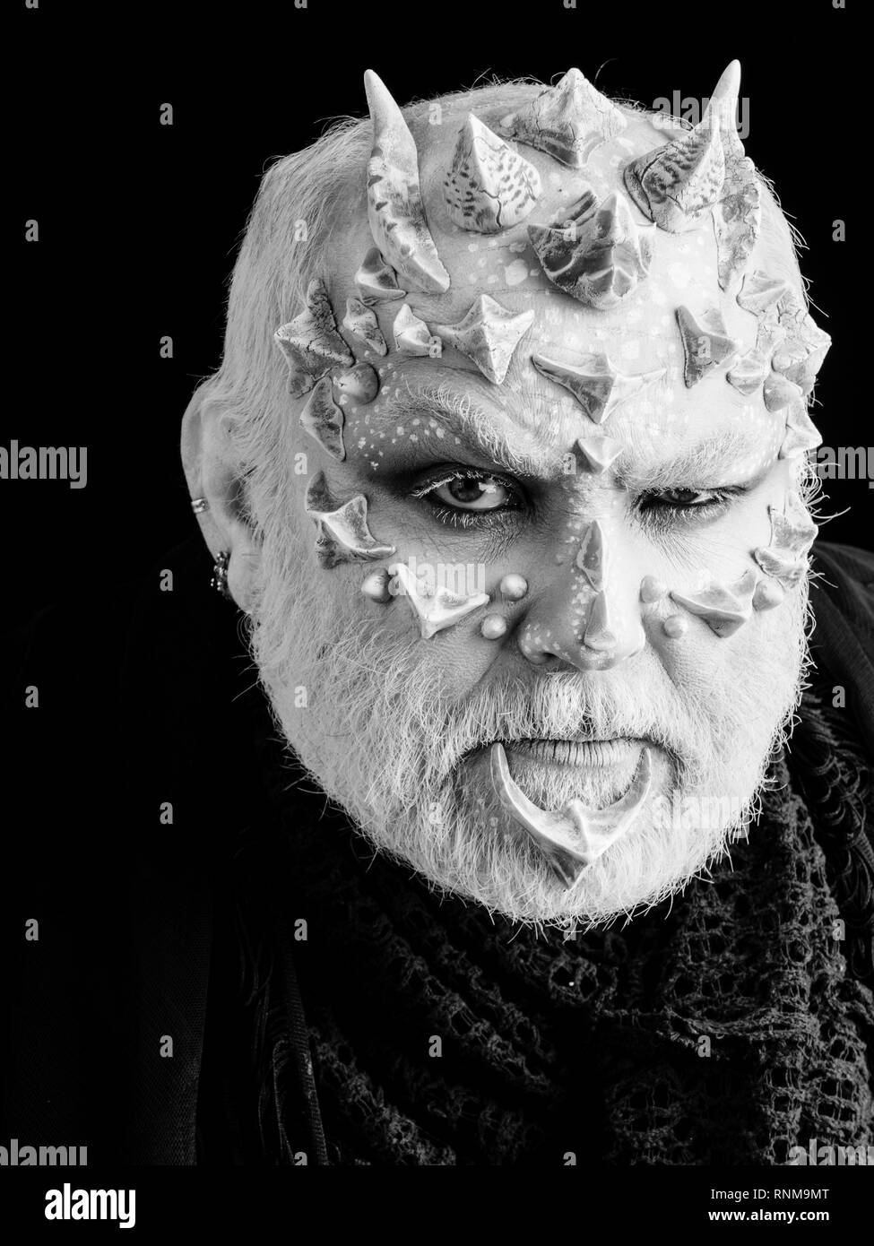 Monster with frowning face and white eyes Stock Photo - Alamy